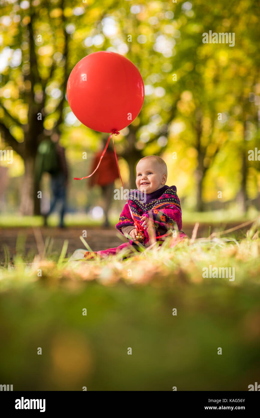 cute happy child baby playing outside in autumn fall sun Stock Photo ...