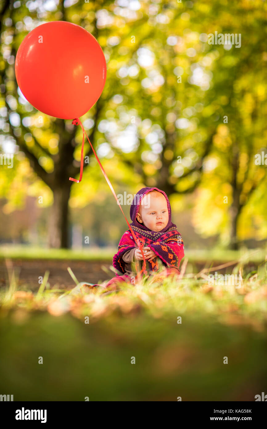 cute happy child baby playing outside in autumn fall sun Stock Photo ...