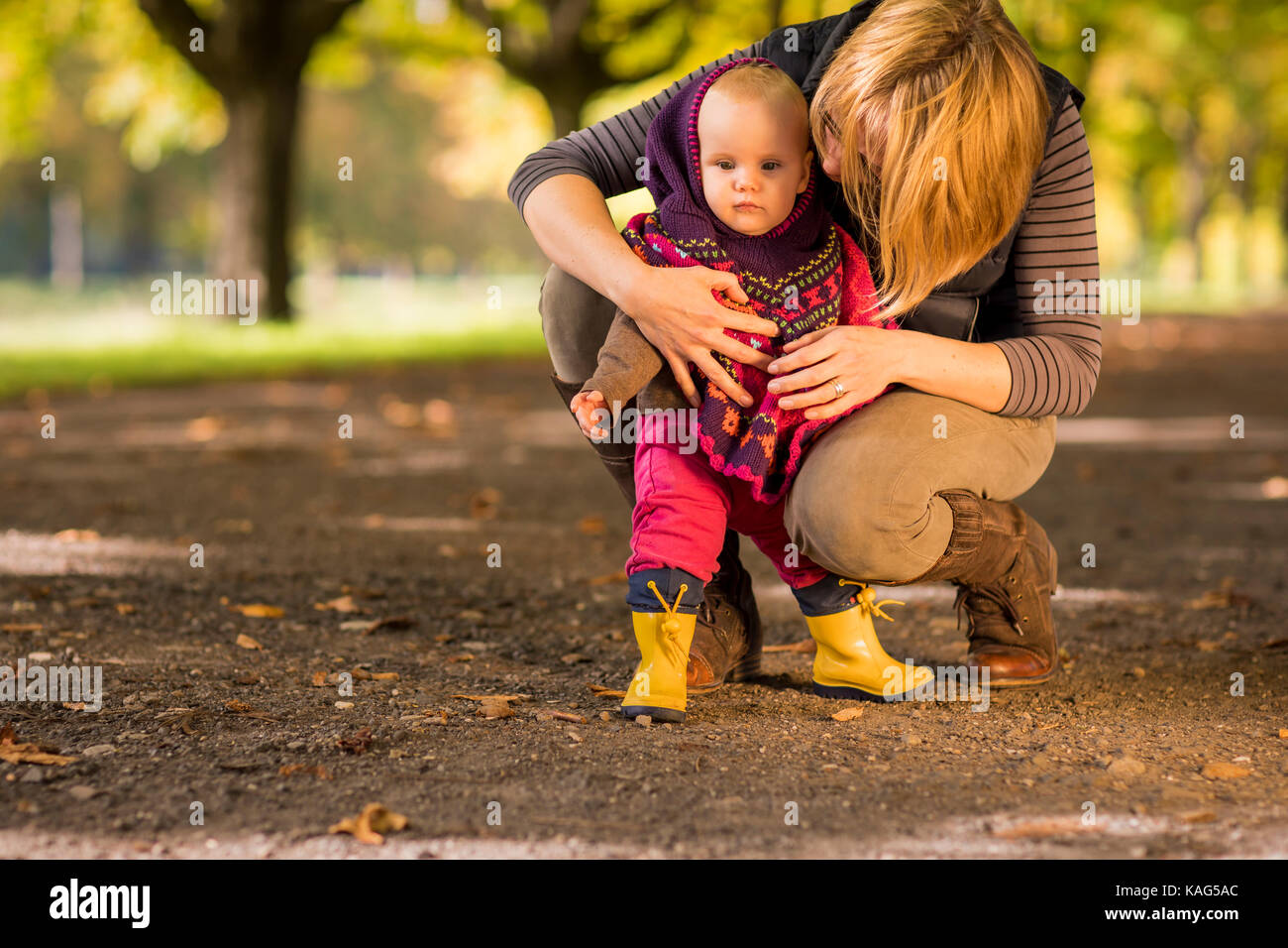 cute happy child baby playing outside in autumn fall sun Stock Photo ...