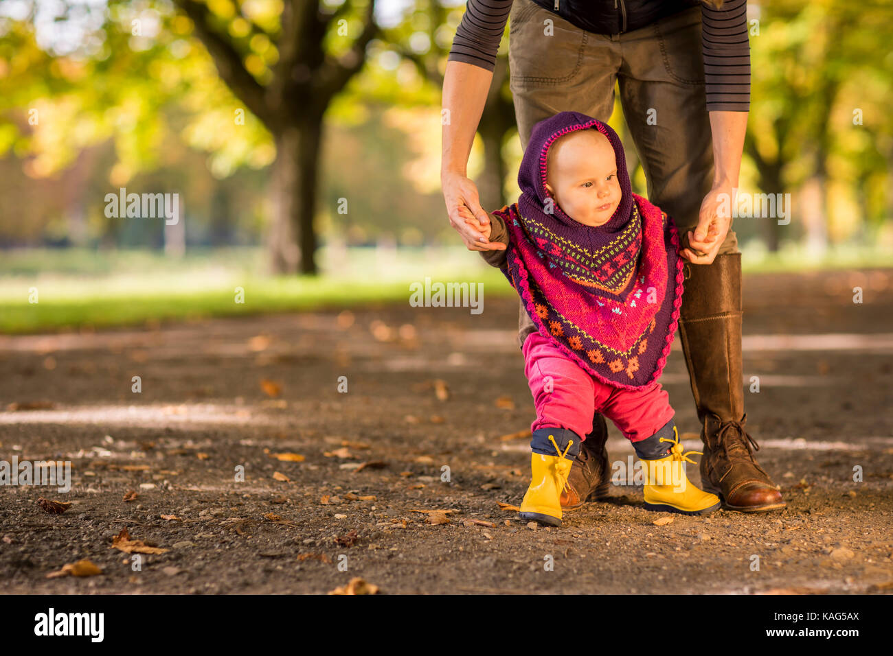 cute happy child baby playing outside in autumn fall sun Stock Photo ...