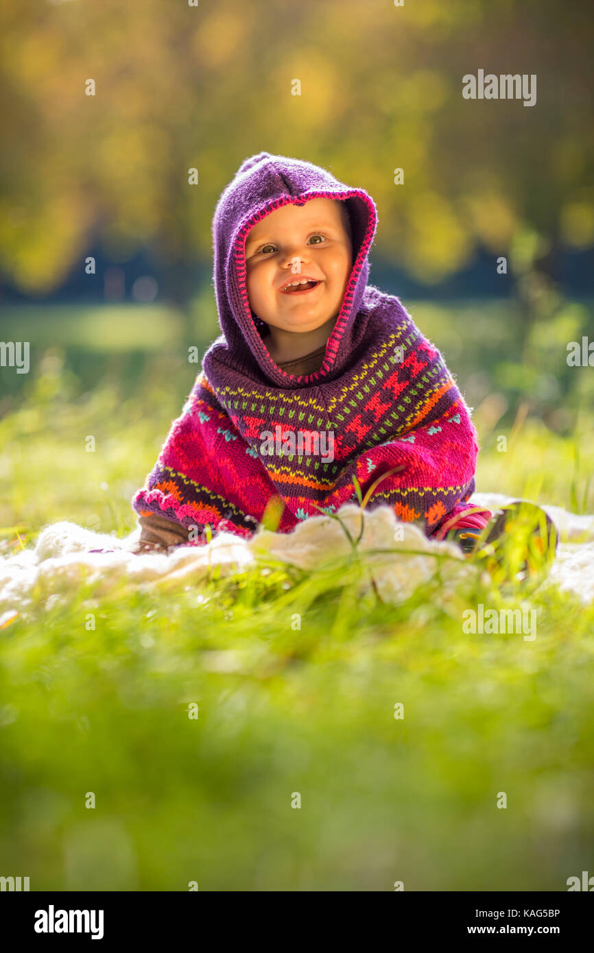 cute happy child baby playing outside in autumn fall sun Stock Photo ...