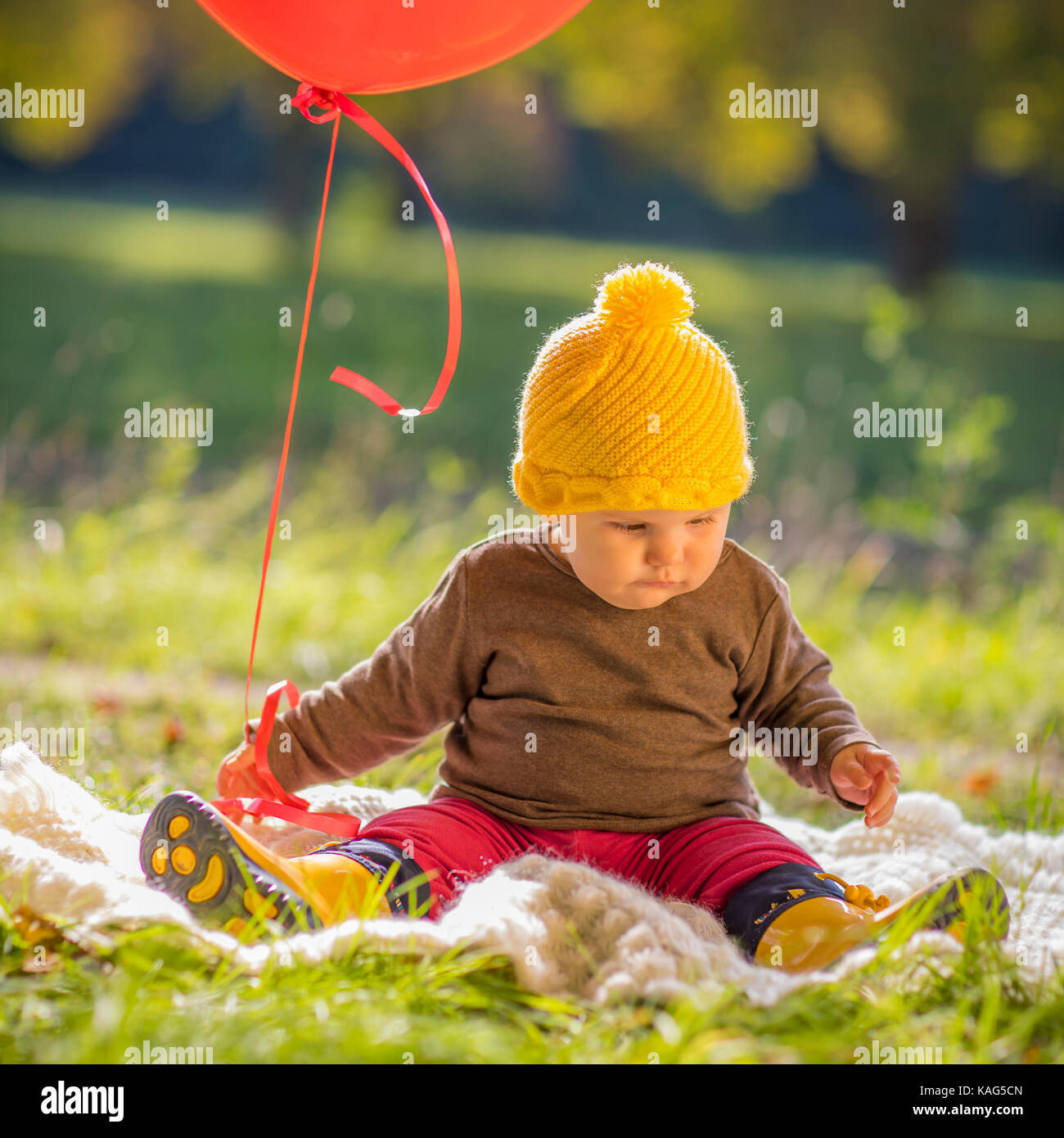 cute happy child baby playing outside in autumn fall sun Stock Photo ...