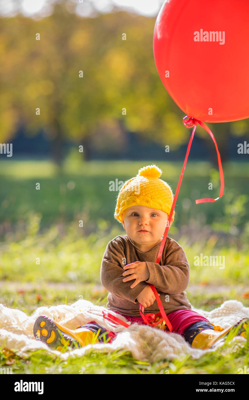 cute happy child baby playing outside in autumn fall sun Stock Photo ...