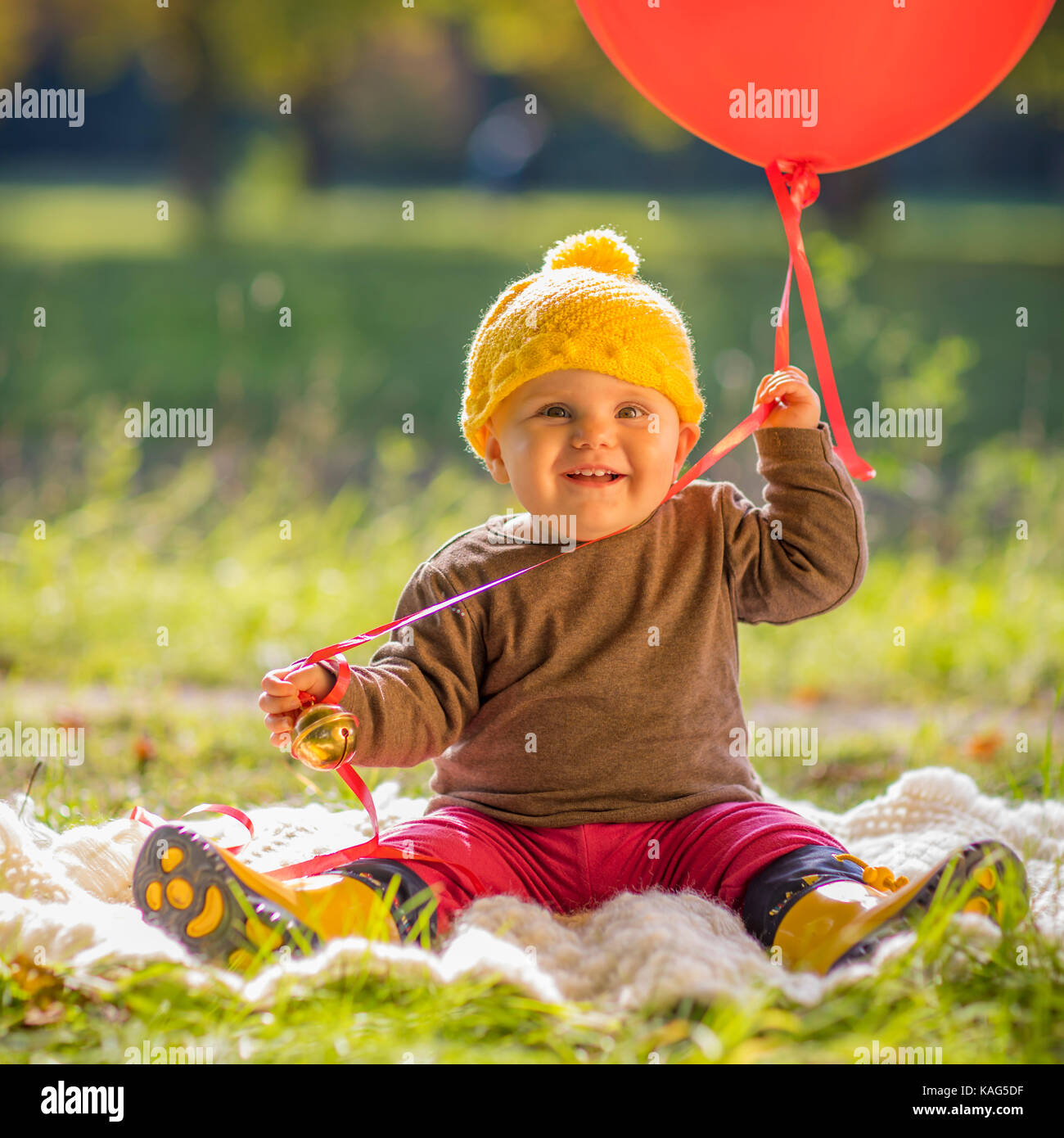 cute happy child baby playing outside in autumn fall sun Stock Photo ...