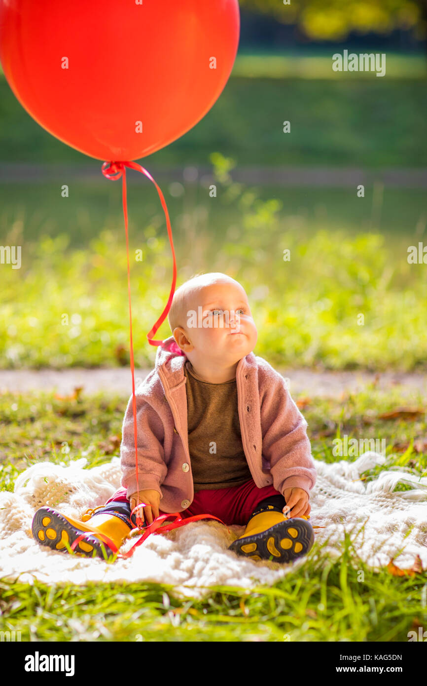 cute happy child baby playing outside in autumn fall sun Stock Photo ...