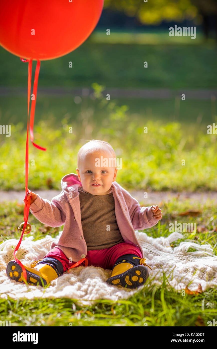 cute happy child baby playing outside in autumn fall sun Stock Photo ...