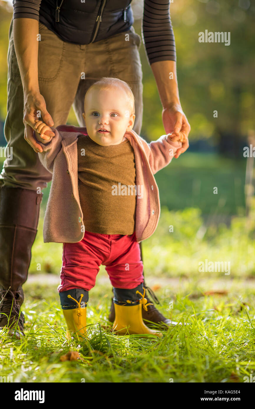 cute happy child baby playing outside in autumn fall sun Stock Photo ...