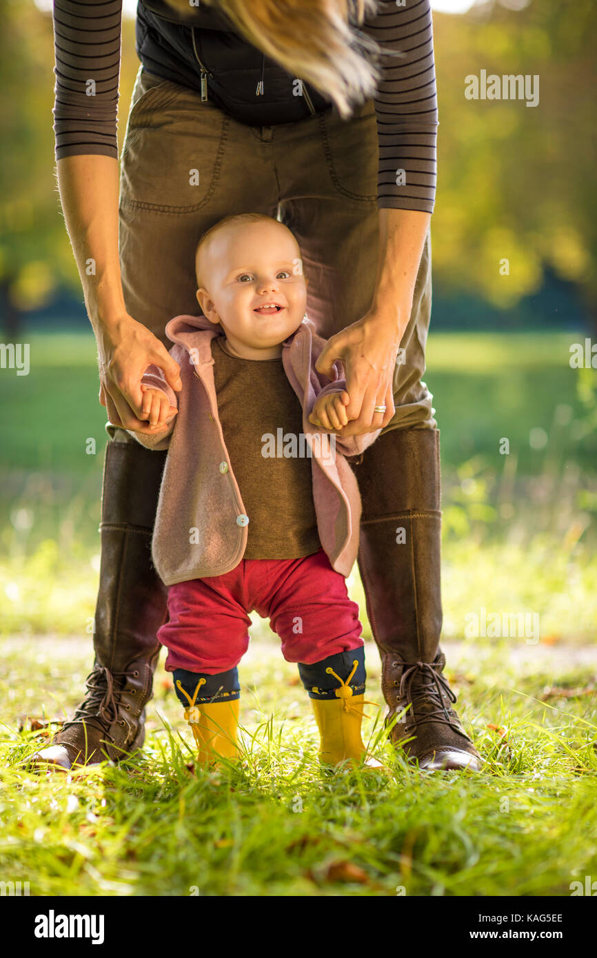 cute happy child baby playing outside in autumn fall sun Stock Photo ...