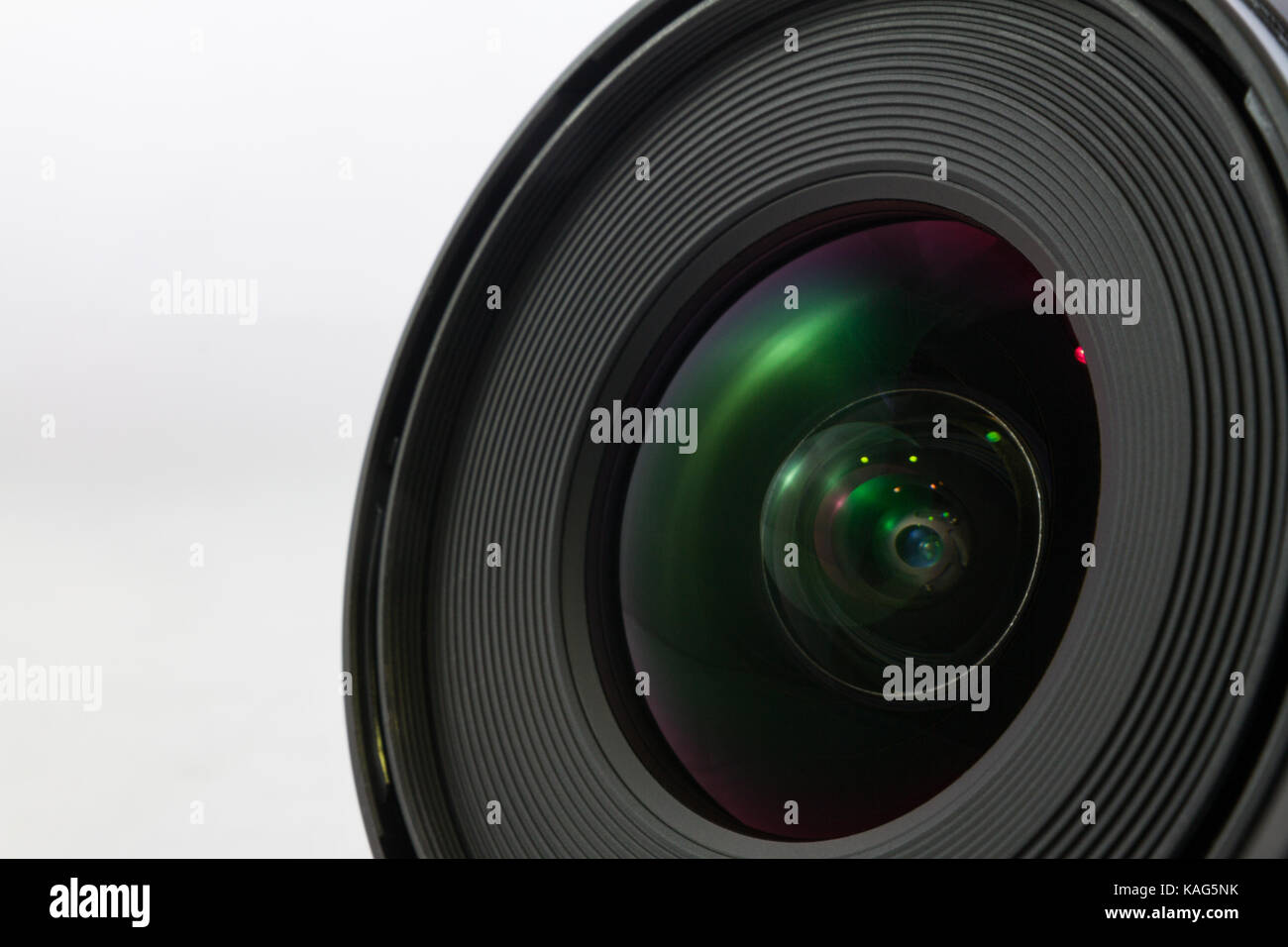 Black camera lens front isolated on white background, lens glass side ...