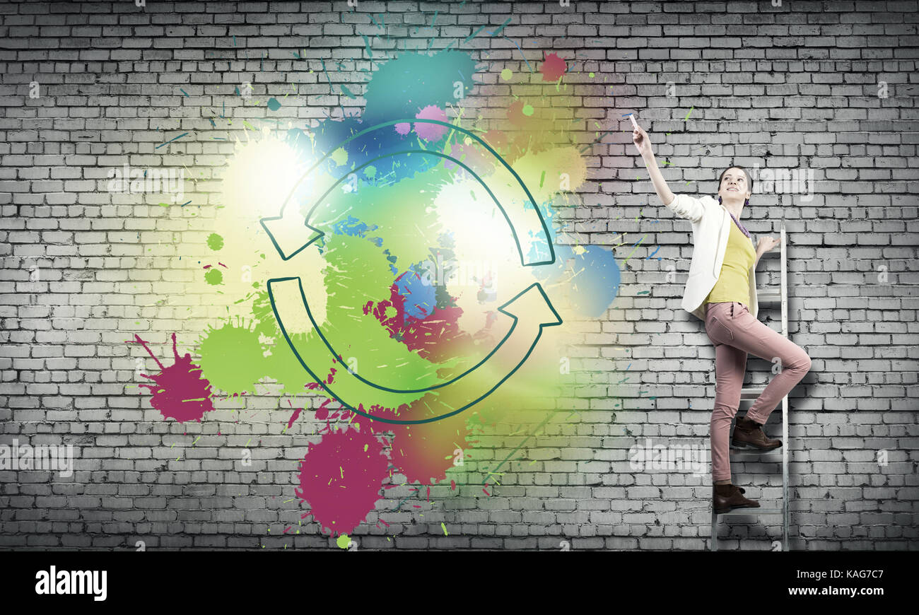 Girl paint wall in colors Stock Photo - Alamy