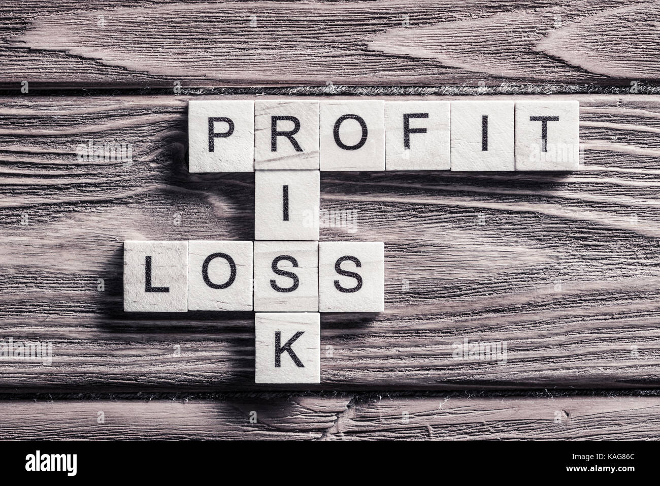 Profit loss and risk words on workplace collected of wooden cube Stock ...
