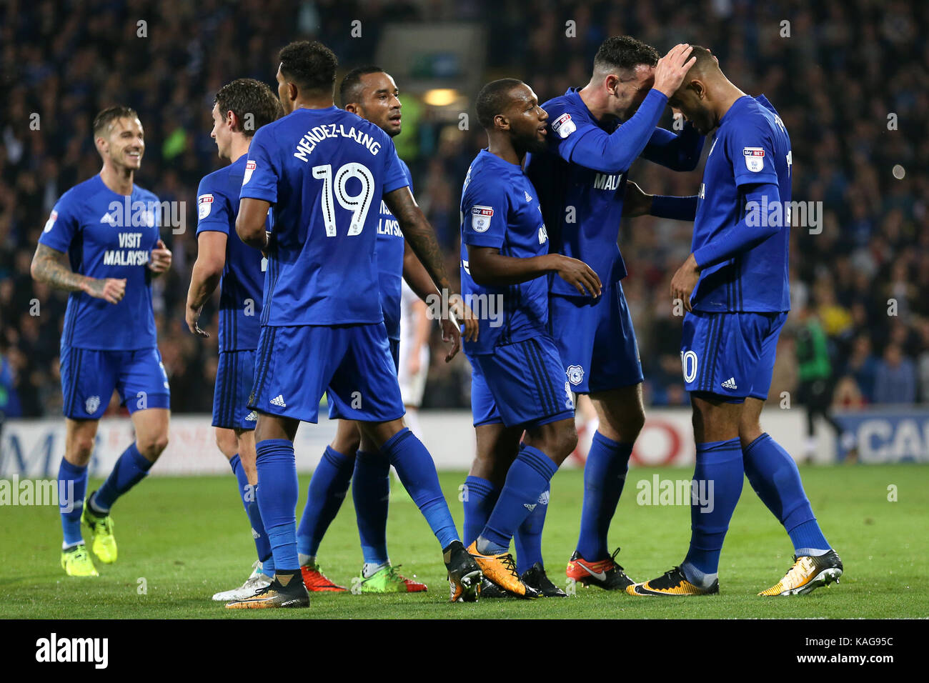 Cardiff City's Kenneth Zohore (right) scores his side's third goal of ...