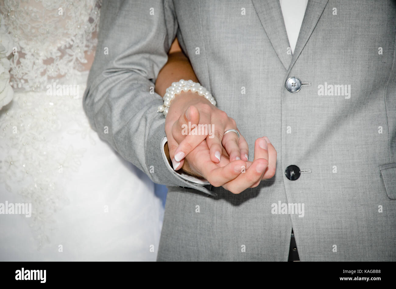 bride and groom holding hands at the wedding Stock Photo - Alamy