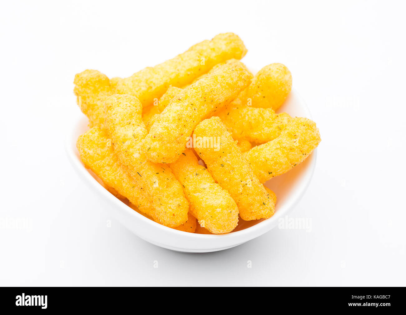 Cheese yellow corn snacks in white bowl on white background Stock Photo ...