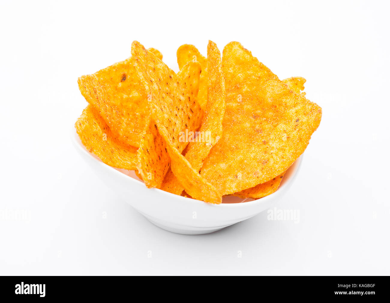 Yellow corn mexican nachos in white bowl on white background Stock ...