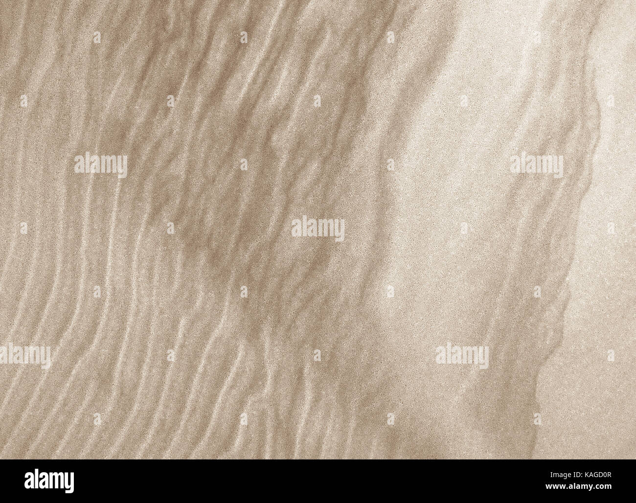 Golden brown sandy beach ripple wave pattern Stock Photo - Alamy