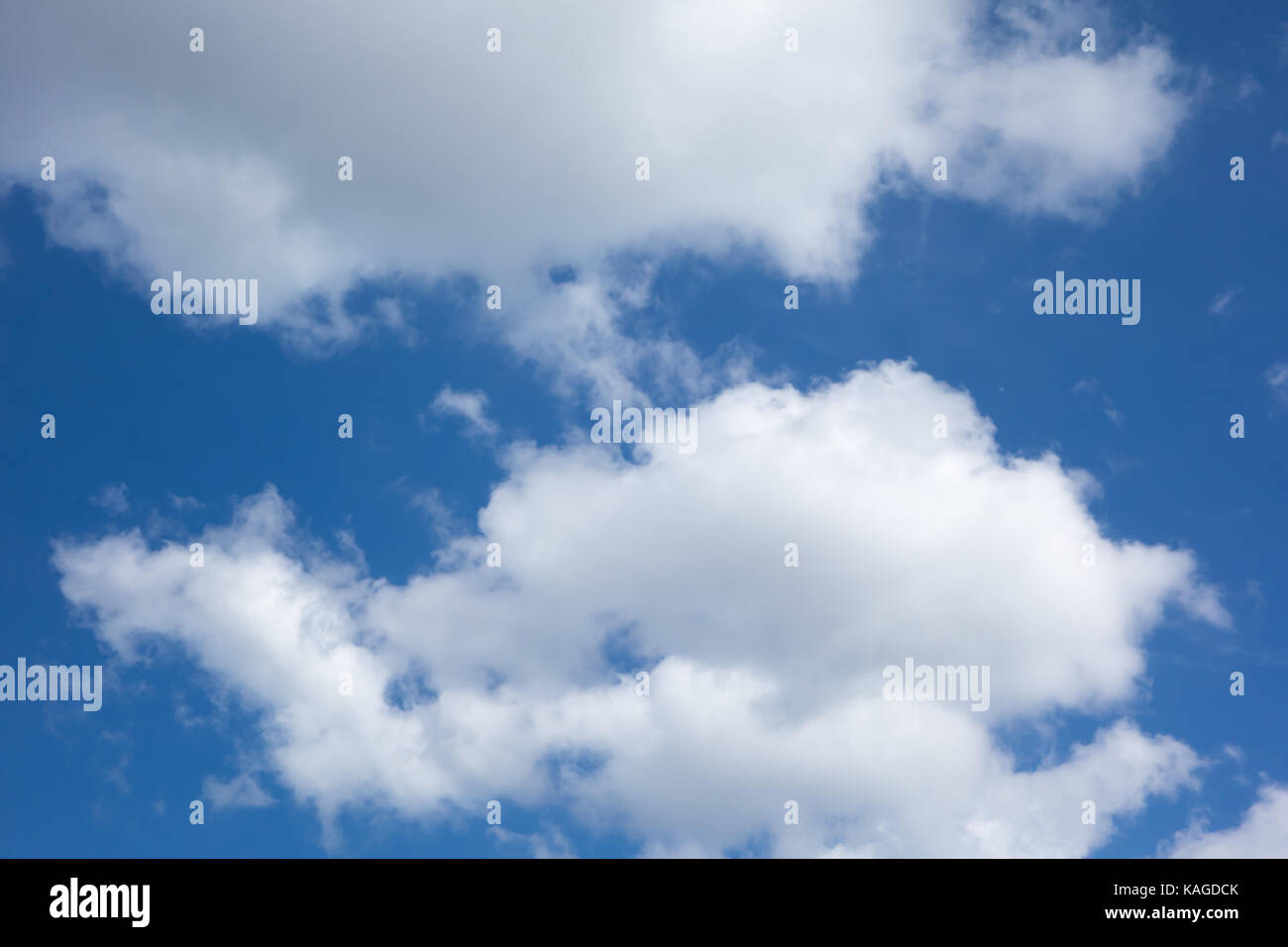 Blue sky with white light clouds in the foreground Stock Photo - Alamy