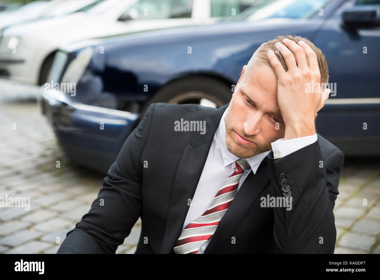 Portrait Of Worried Young Man With Damaged Car Stock Photo - Alamy