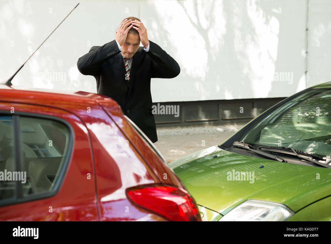 Stressed Driver Standing At Roadside After Traffic Accident Stock Photo ...