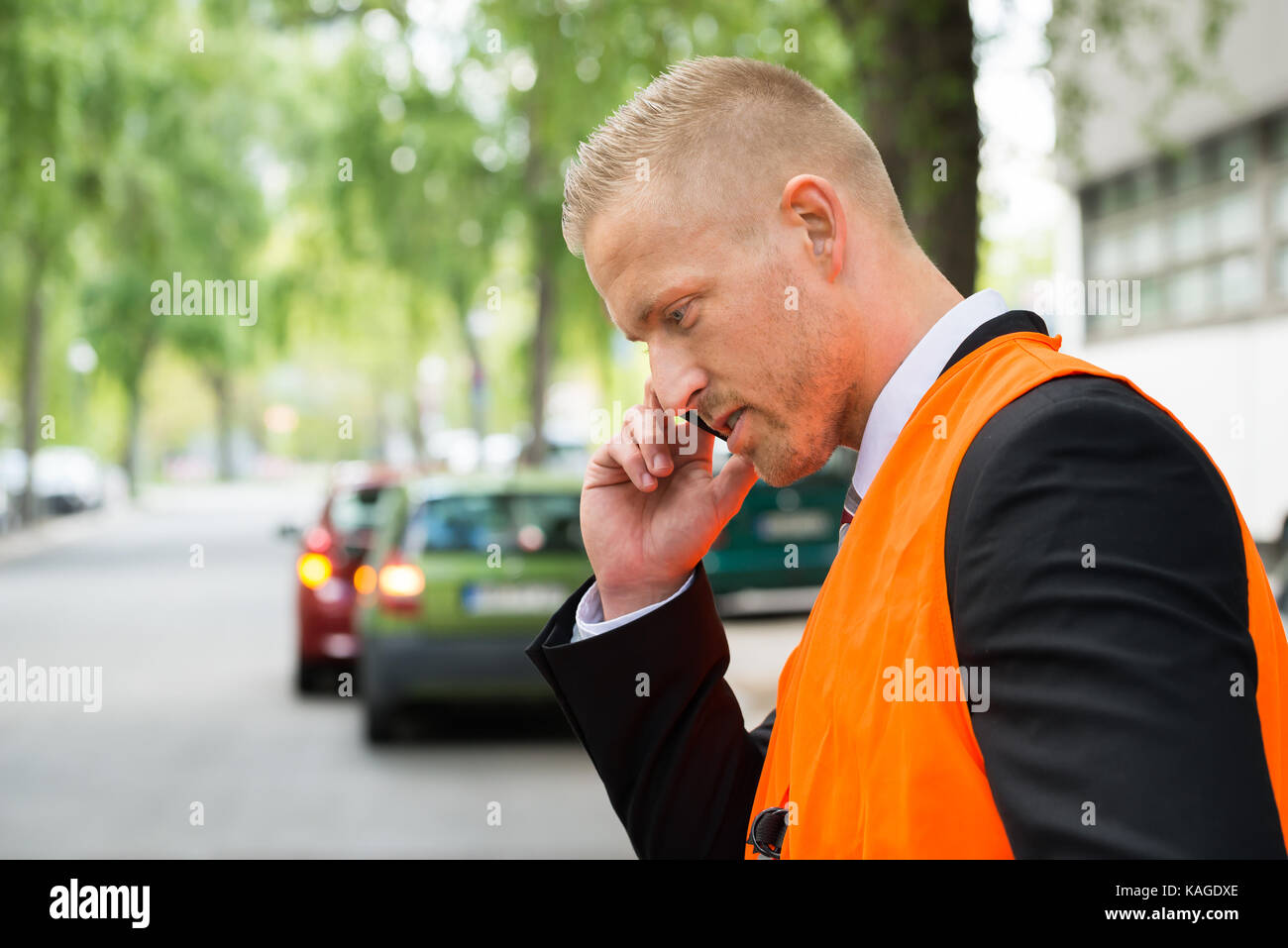 Young Male Driver Making Phone Calls With A Broken Down Cars On Road ...