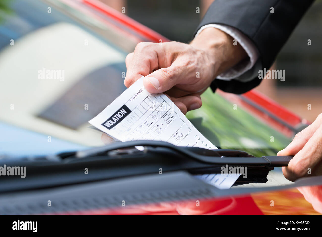 Close-up Of A Man Taking Parking Ticket On Car's Windshield Stock Photo ...