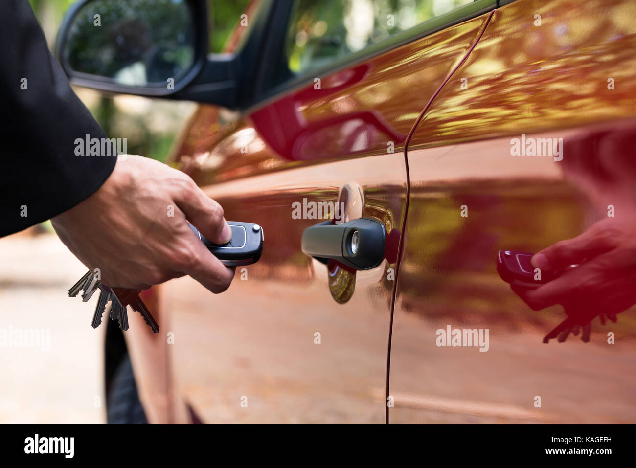 Close-up Of A Person's Hand Holding A Car's Remote Control Pointing To ...