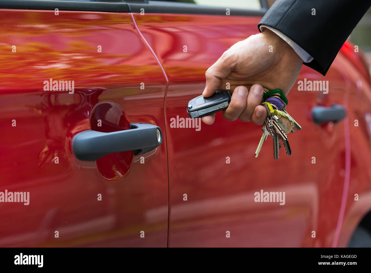 Close-up Of A Person's Hand Holding A Car's Remote Control Pointing To ...