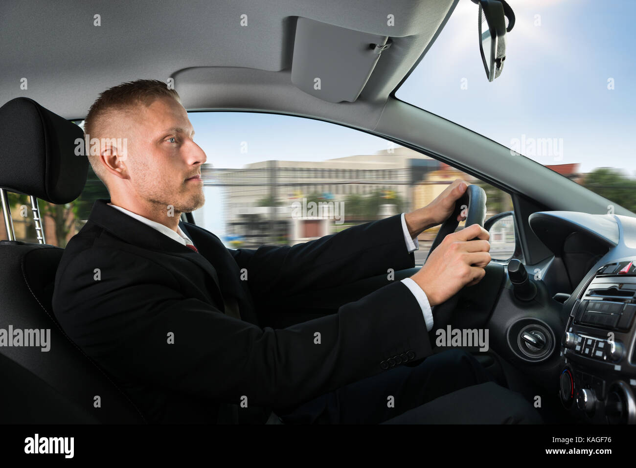 Photo Of Confident Young Businessman Driving His Car Stock Photo - Alamy
