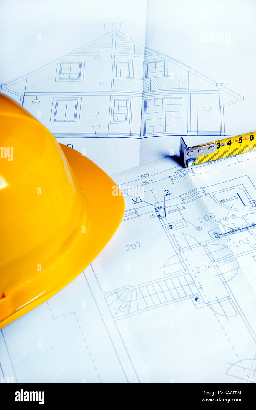 construction work hard hat, blueprint and measurement tape Stock Photo ...