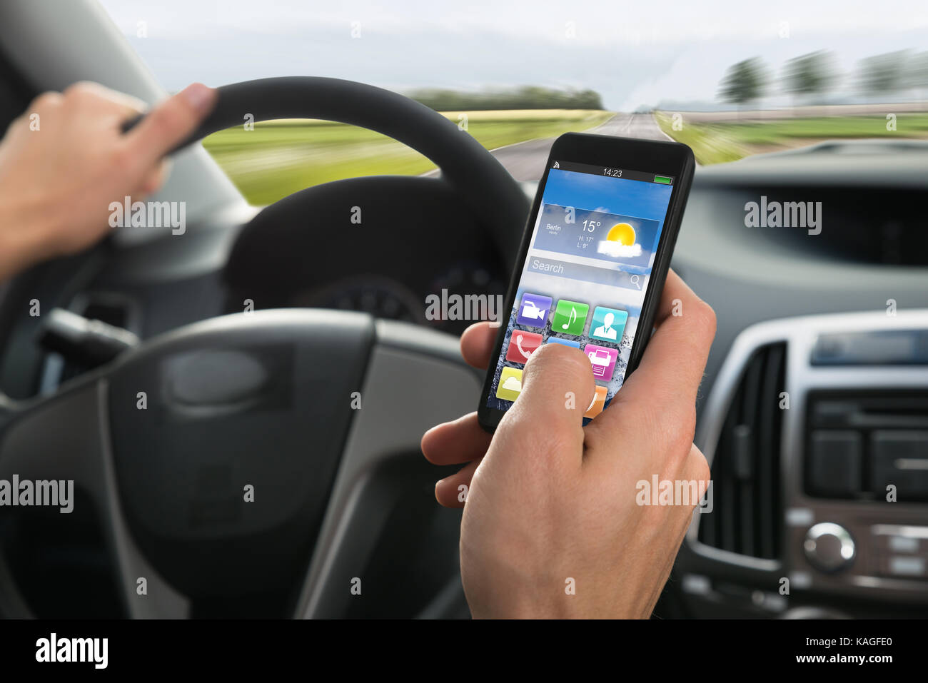 Close-up Of A Person's Hand Using Cellphone While Driving A Car Stock ...