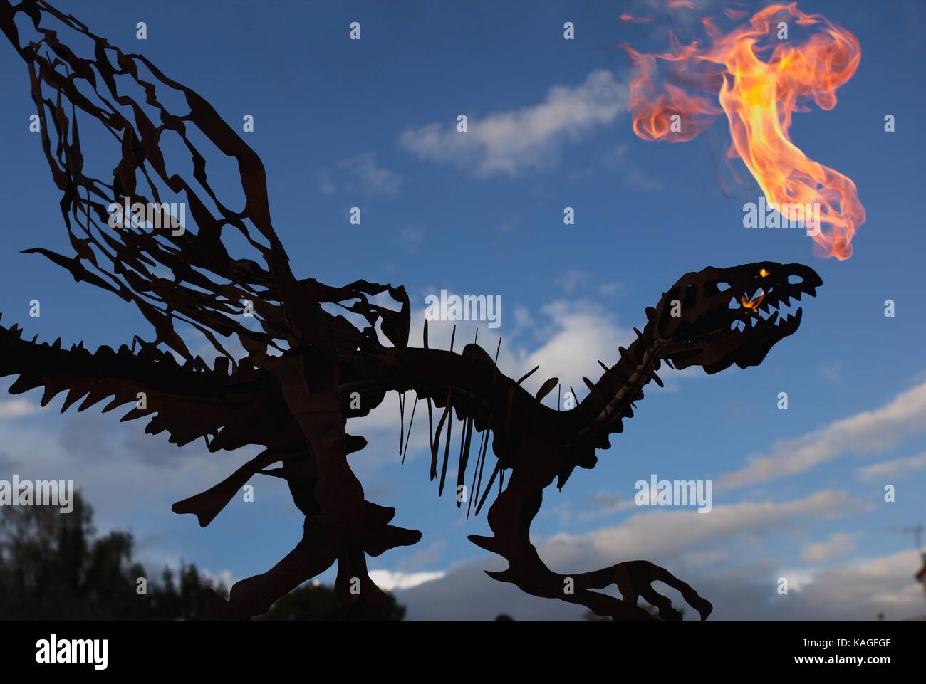 Dragon Silhouette spitting fire Stock Photo - Alamy