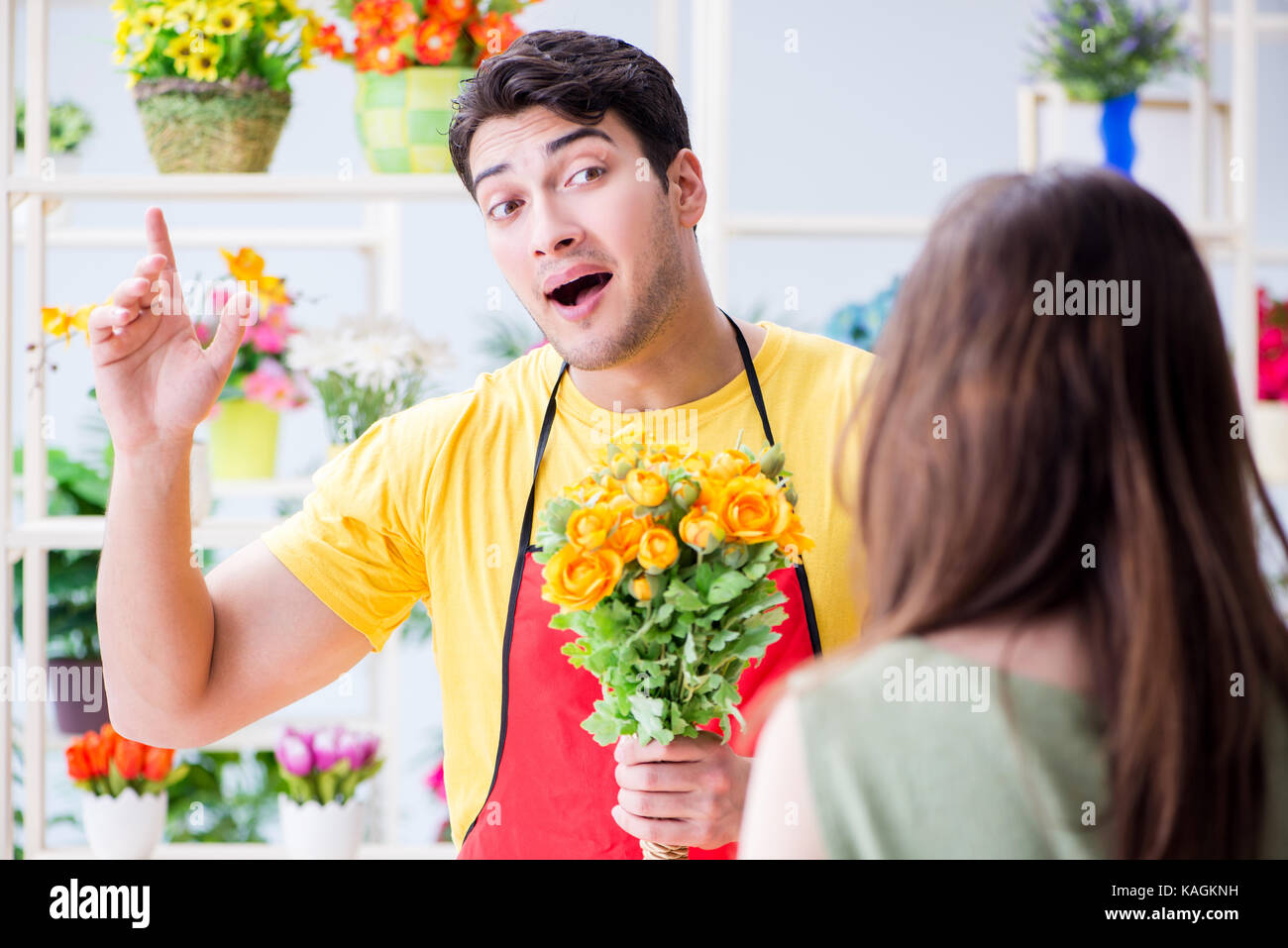 Florist selling flowers in a flower shop Stock Photo - Alamy