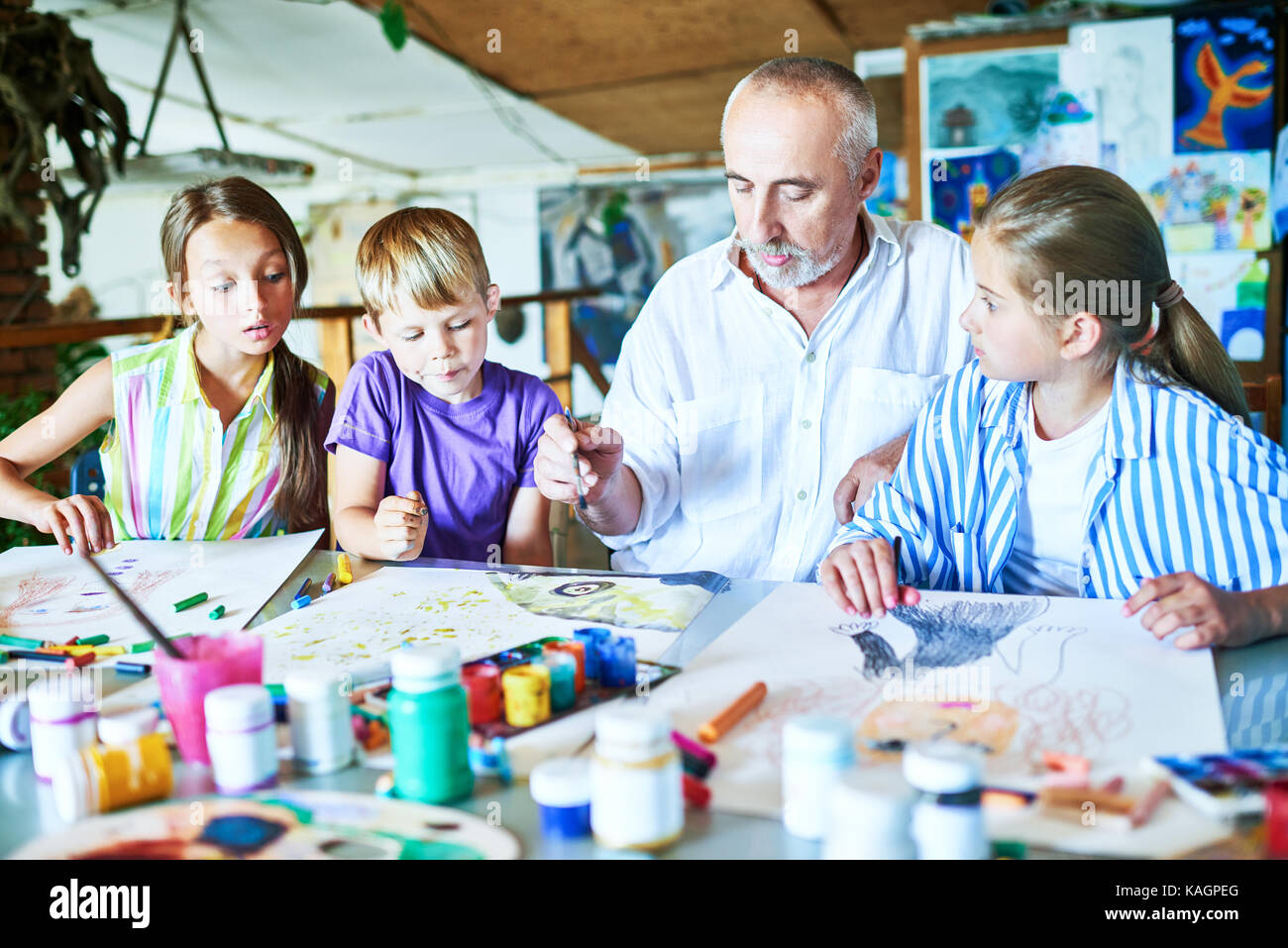 Senior Man Teaching Art Class Stock Photo - Alamy