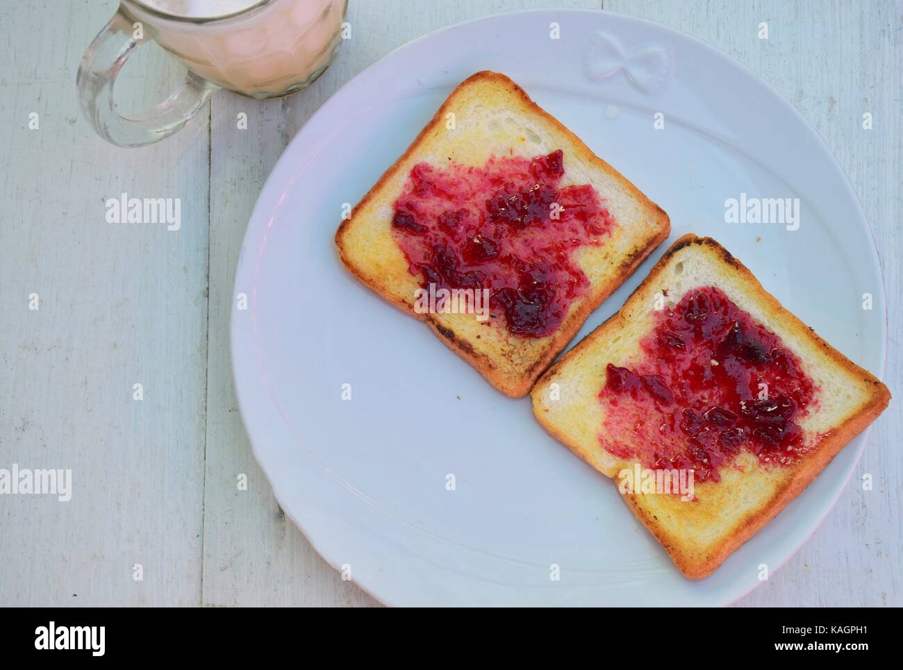 Sandwich toast with cherry jam Stock Photo - Alamy