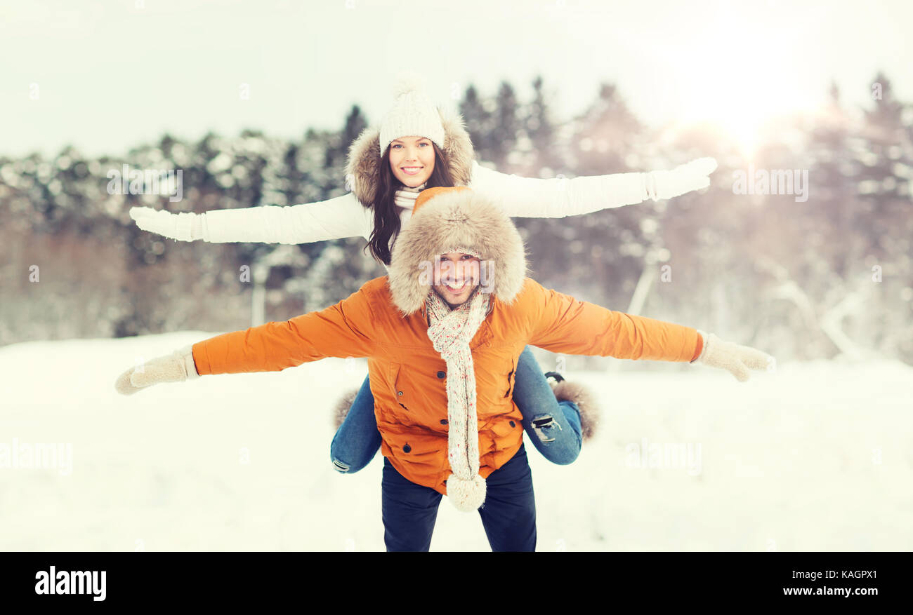 happy couple having fun over winter background Stock Photo - Alamy