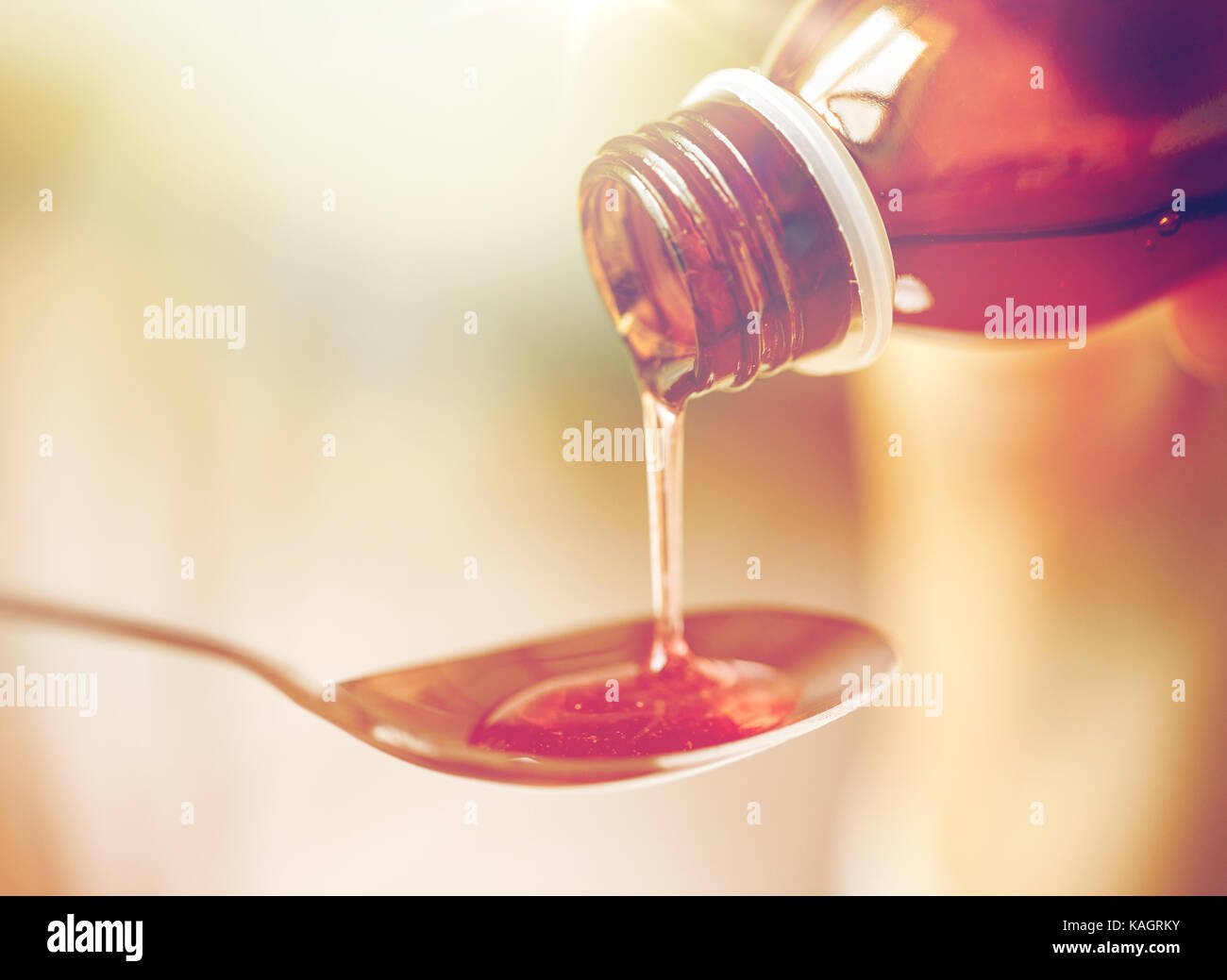 Cough syrup pouring spoon hi-res stock photography and images - Alamy
