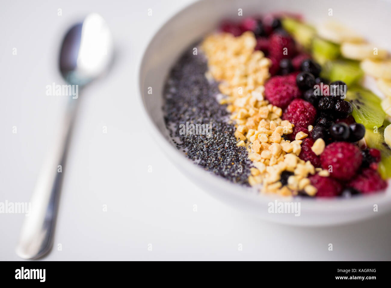 bowl of yogurt with fruits and seeds Stock Photo - Alamy