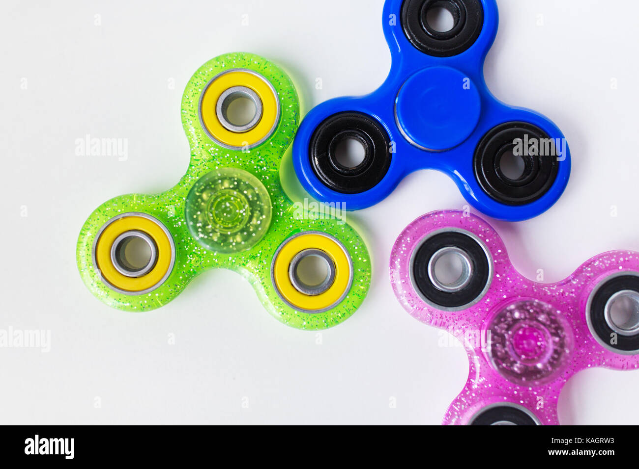 close up of fidget spinners on white background Stock Photo - Alamy