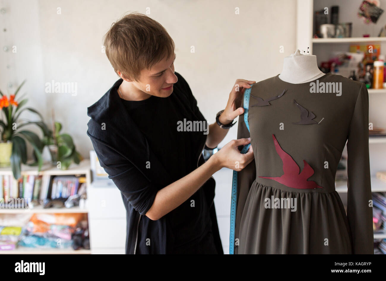fashion designer with dummy making dress at studio Stock Photo - Alamy