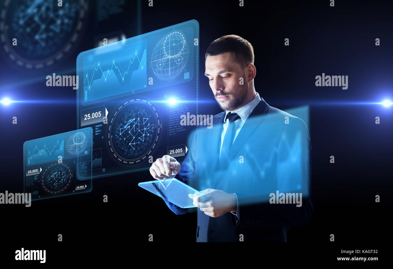 businessman with tablet pc and virtual screens Stock Photo - Alamy