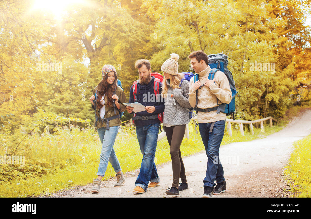 group of smiling friends with backpacks hiking Stock Photo - Alamy