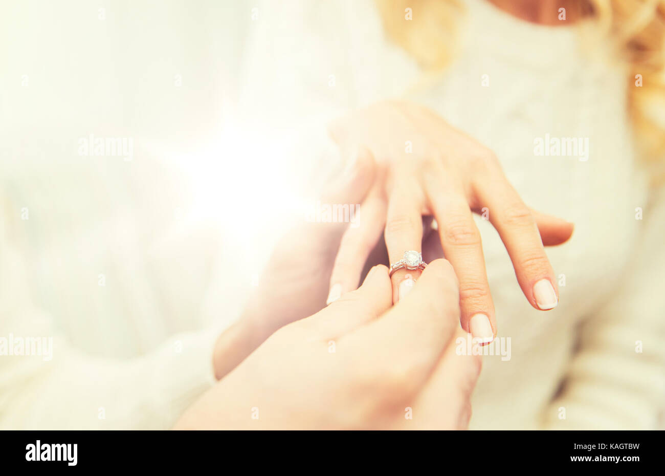 close up of man giving diamond ring to woman Stock Photo - Alamy
