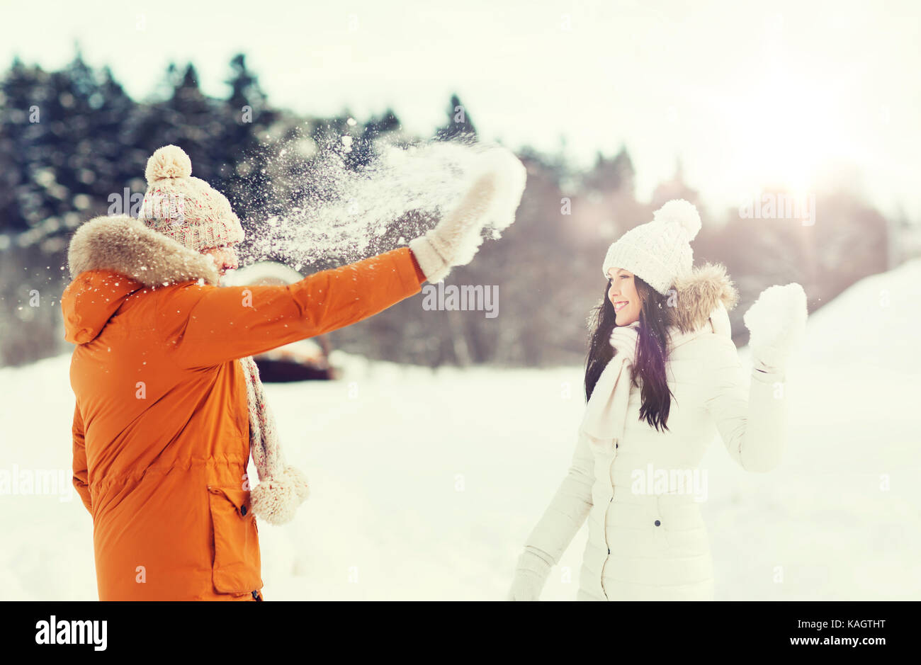 happy couple playing with snow in winter Stock Photo - Alamy