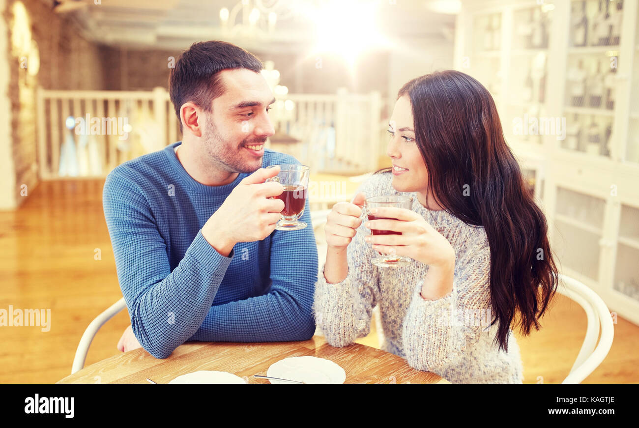 happy couple drinking tea at cafe Stock Photo - Alamy