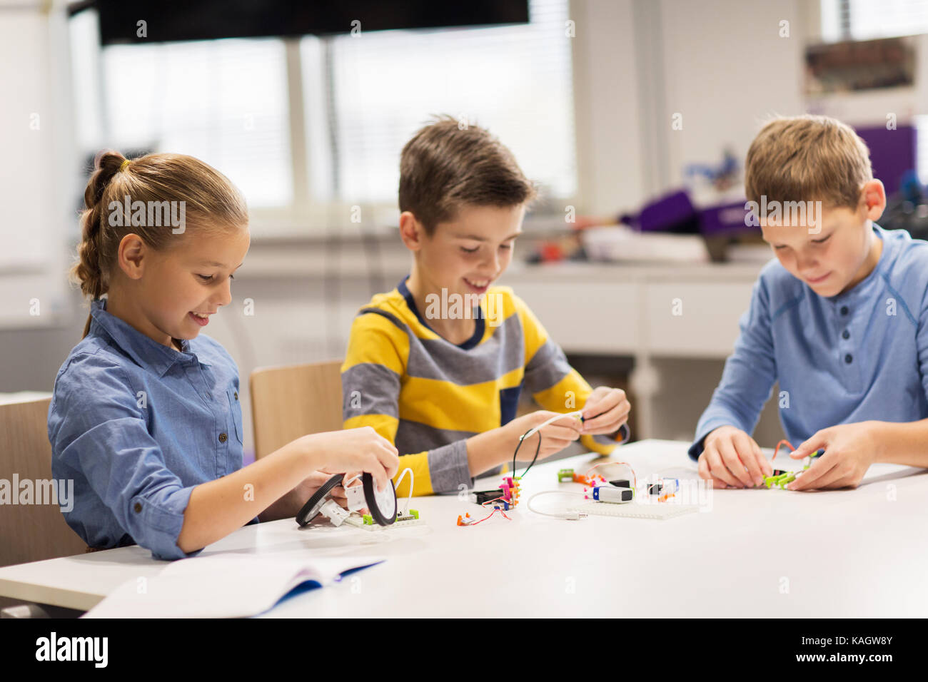 happy children building robots at robotics school Stock Photo - Alamy