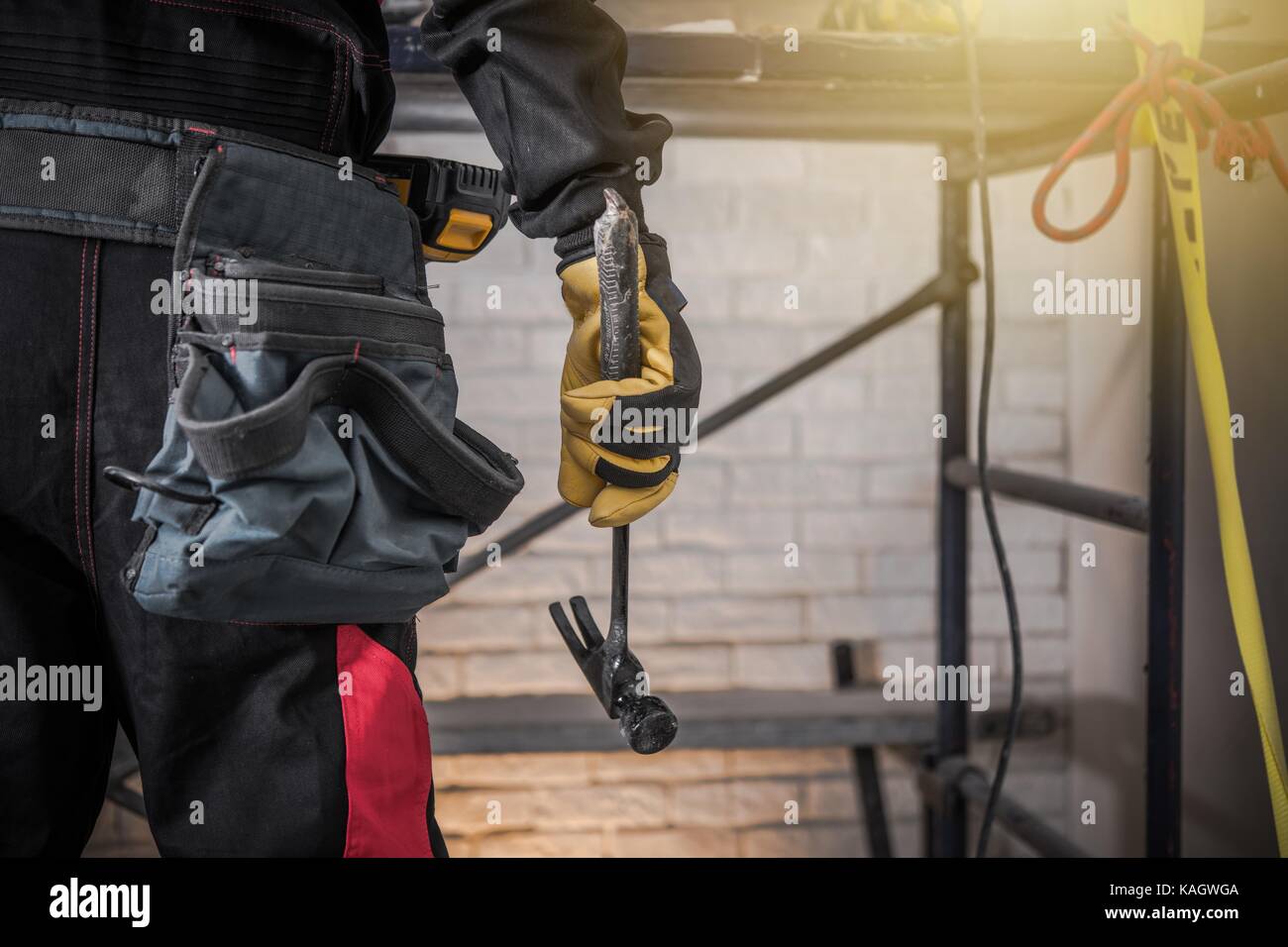 Construction Site Contractor with Hammer in Front of Scaffolding ...