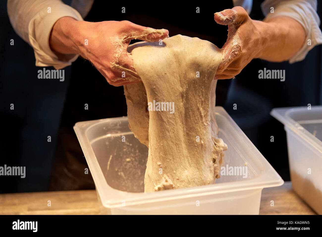 Close up professional baker kneading hi-res stock photography and ...