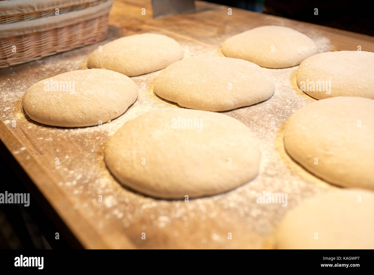 yeast bread dough on bakery kitchen table Stock Photo - Alamy