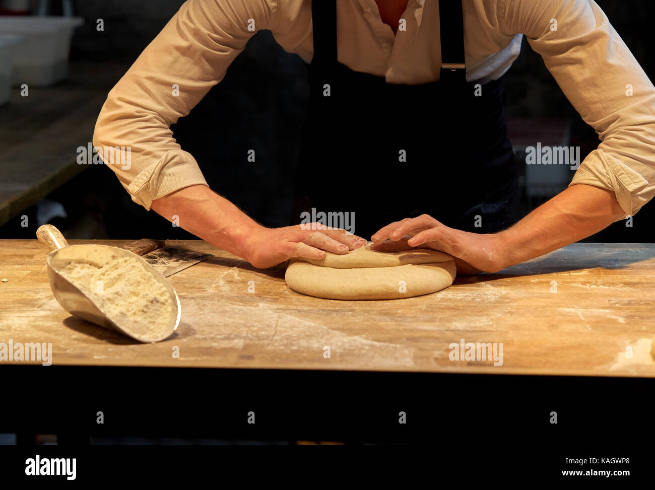 baker making bread dough at bakery kitchen Stock Photo - Alamy
