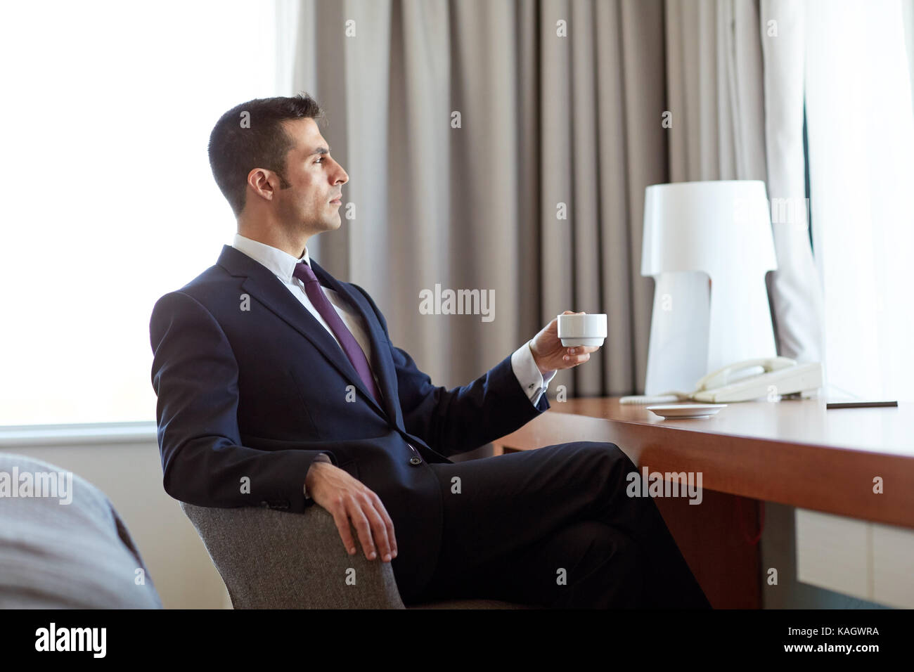 businessman drinking coffee at hotel room Stock Photo - Alamy